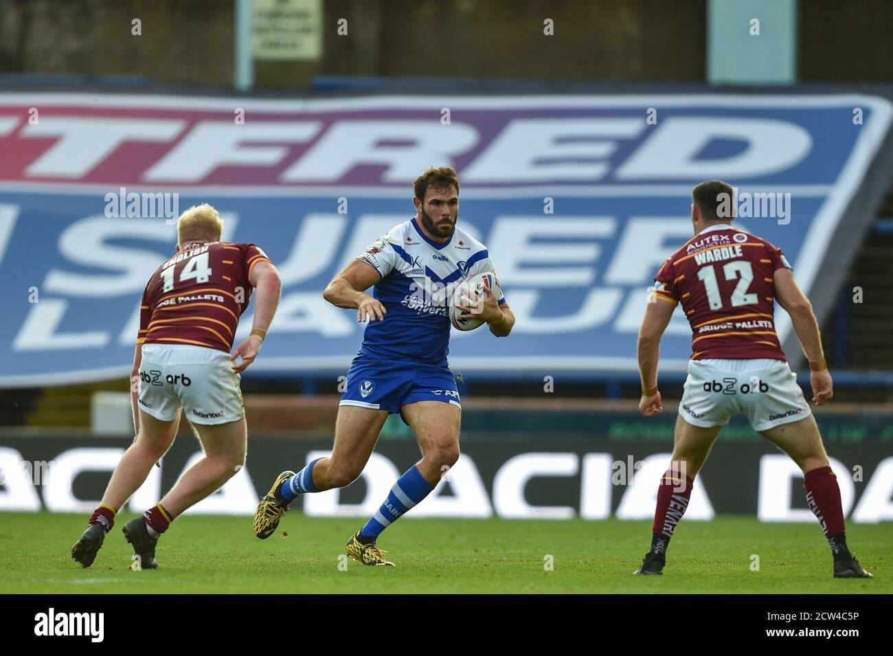 Alex Walmsley (8) of St Helens heads in to the huddersfield defence ...