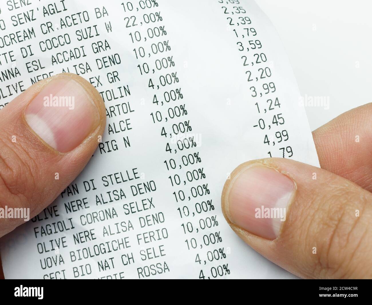 Closeup hands holding and check shopping bill Receipt Stock Photo - Alamy