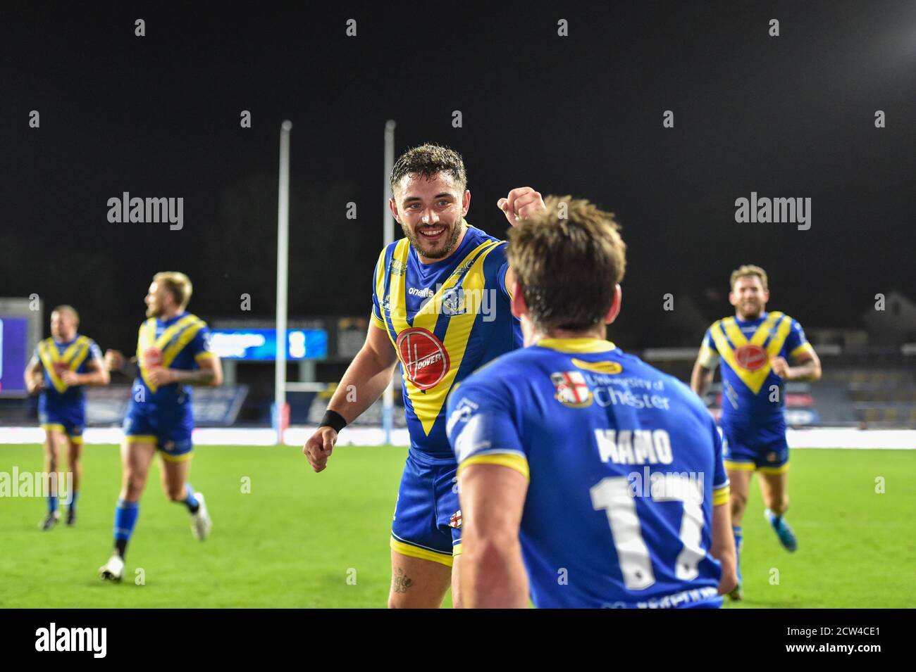 Declan Patton (21) of Warrington Wolves celebrates Jake Mamo (17) of ...