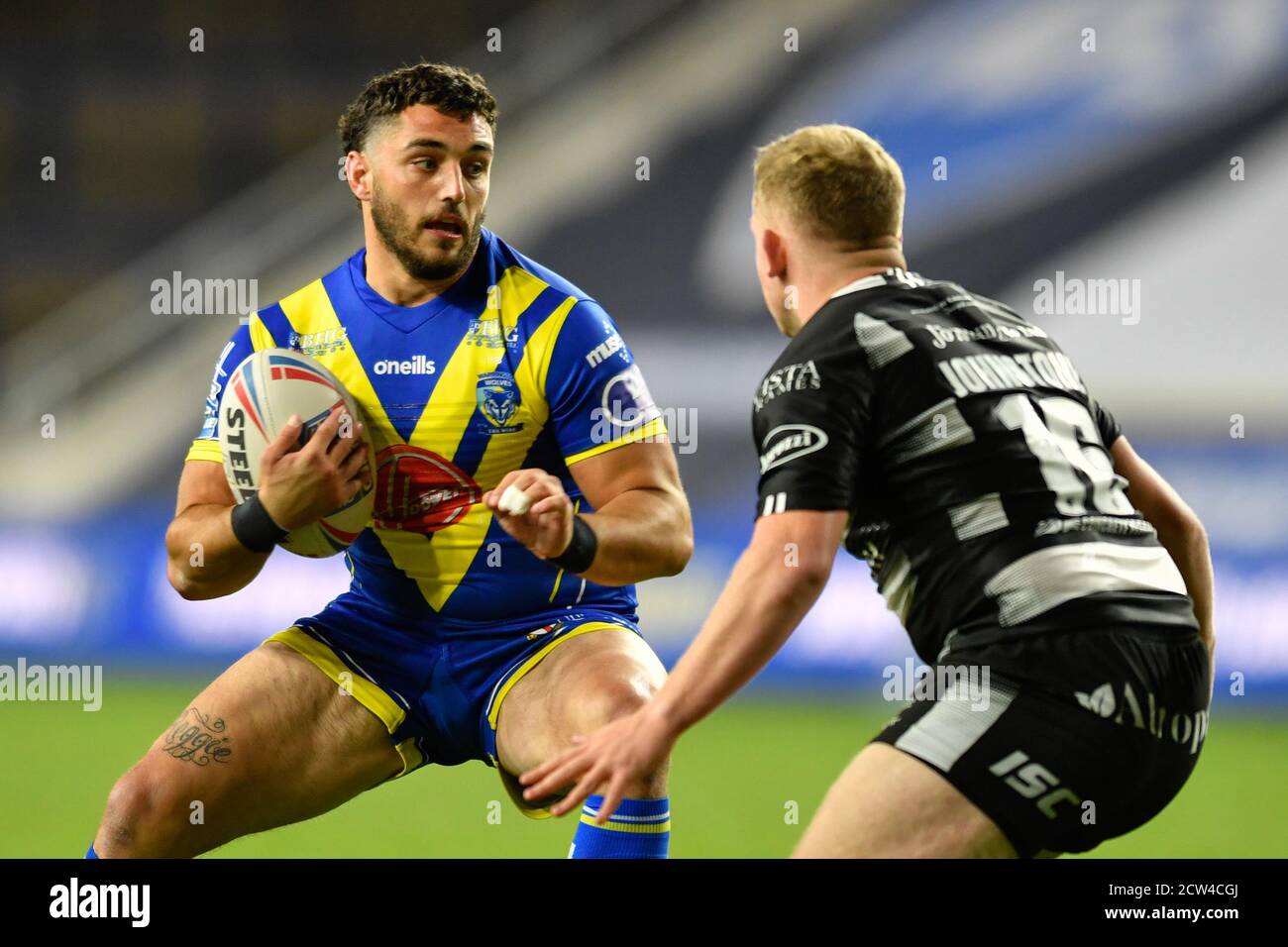 Declan Patton (21) of Warrington Wolves looks for a way past Jordan ...