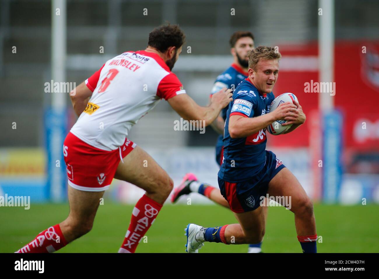 Jez Litten (18) of Hull KR tackled by Alex Walmsley (8) of St Helens ...
