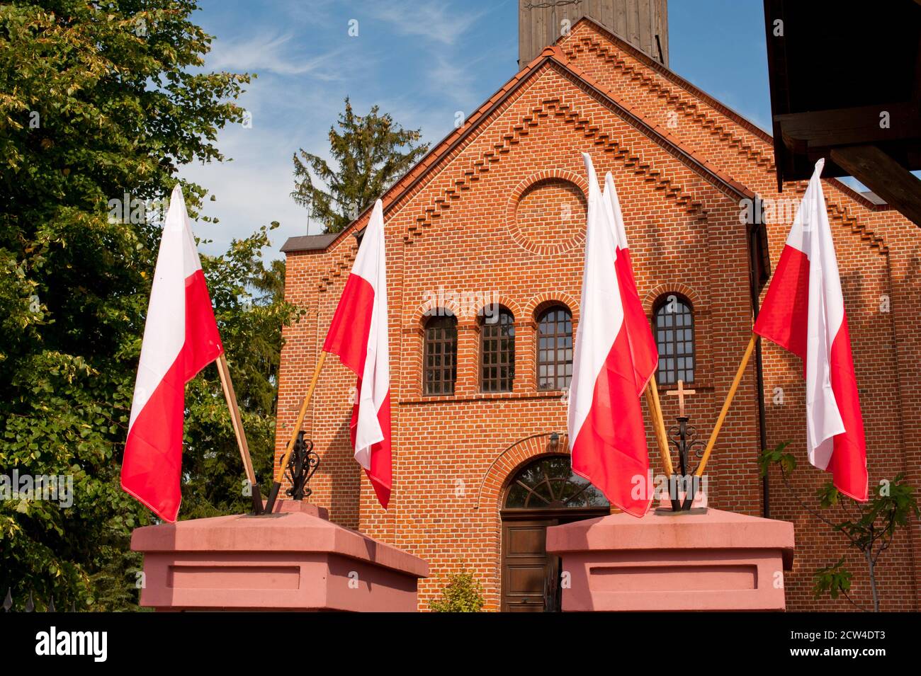 Polish flags (church in Szczepanowo in Poland Stock Photo - Alamy