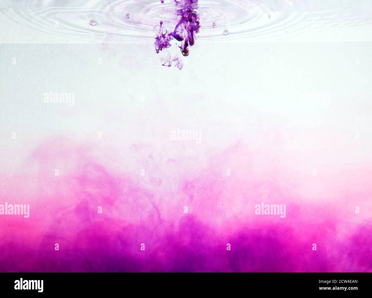 Ink dissolving in water Stock Photo - Alamy