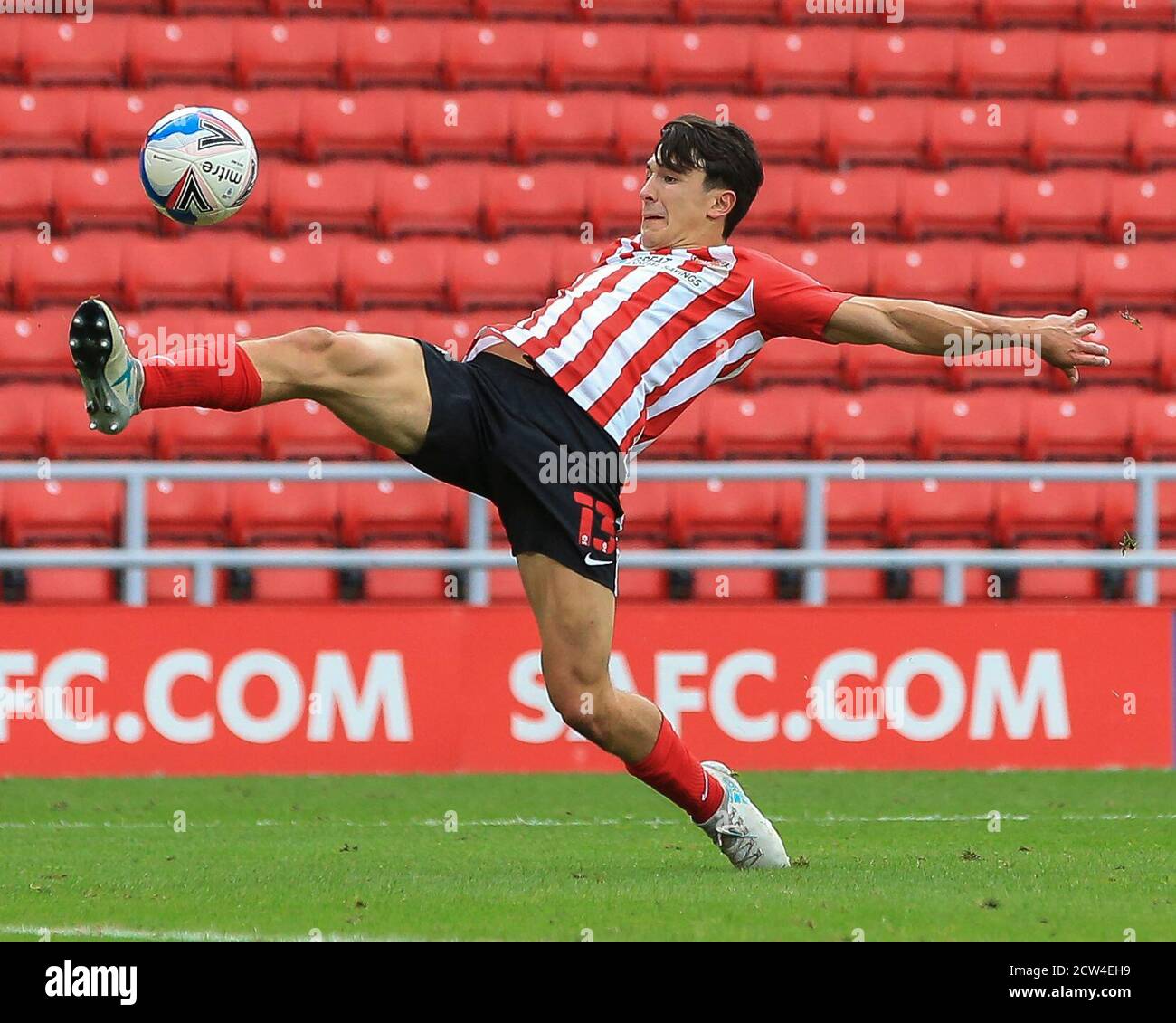 Luke O'Nien (13) of Sunderland stretches to control the ball Stock ...