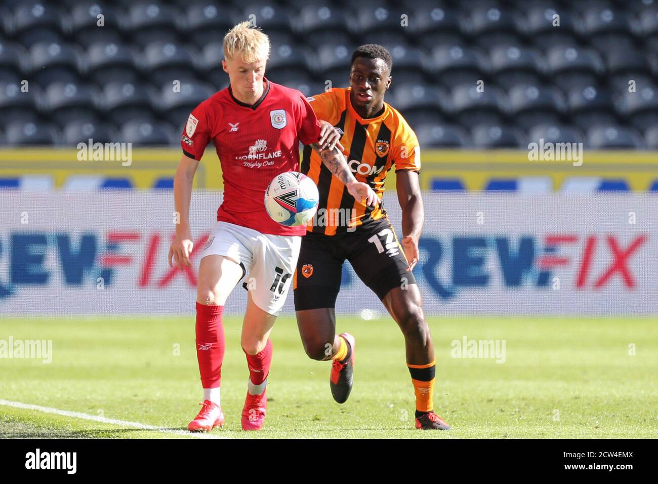 Charlie Kirk (10) of Crewe Alexandra and Joshua Emmanuel (12) of Hull ...