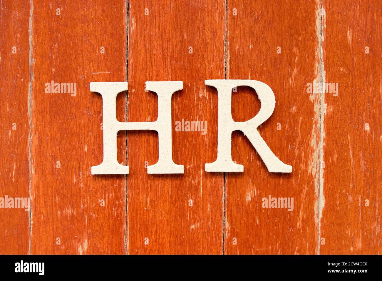 Alphabet letter in word HR (Abbreviation of human resource) on old red ...