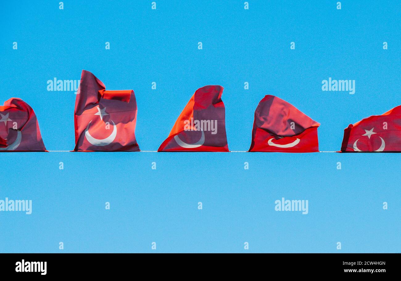 Turkish national flags with white star and moon in sky Stock Photo - Alamy