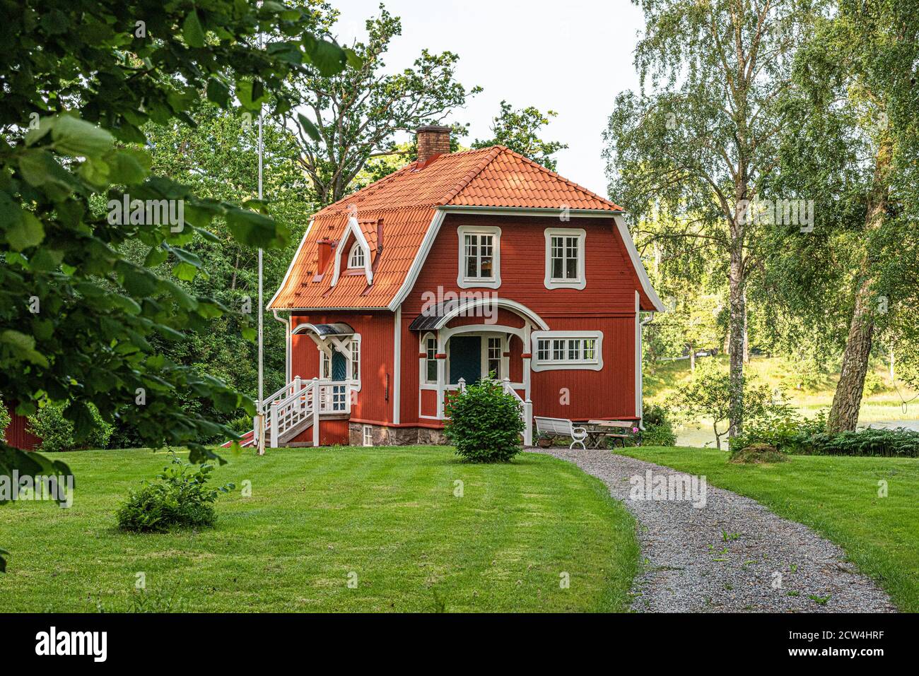 Traditional swedish red and white house and garden Stock Photo - Alamy