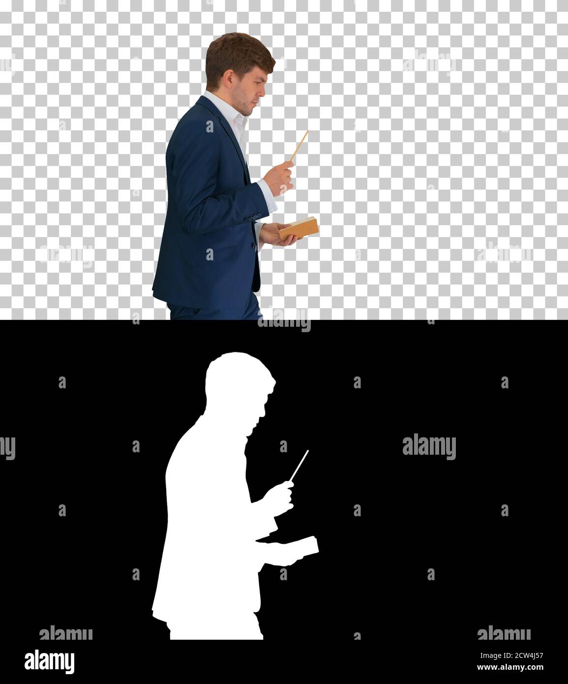 Thinking businessman writing notes in his notebook while walking Stock ...