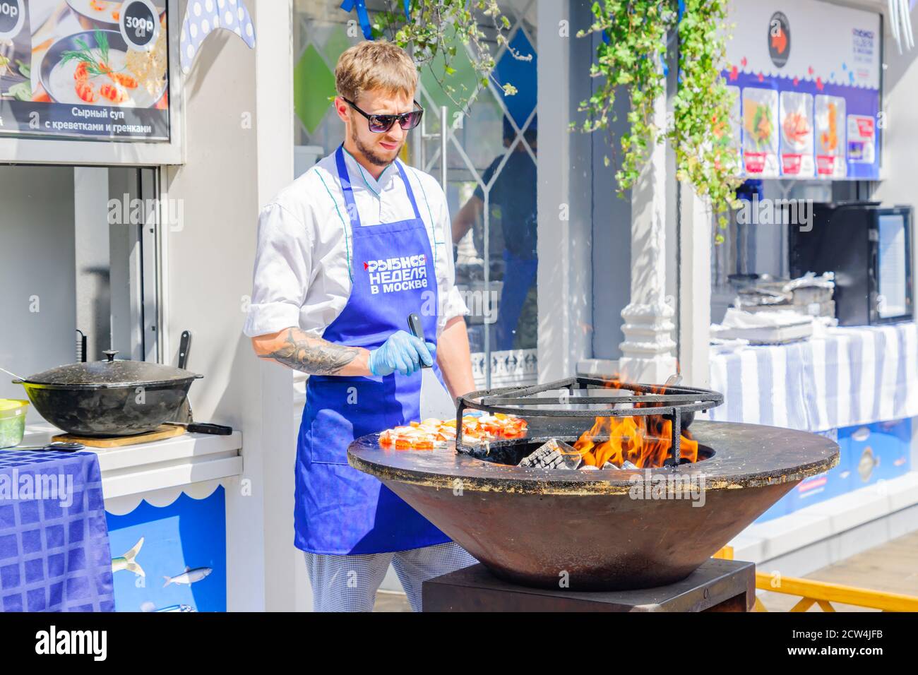 MOSCOW, RUSSIA - MAY 30, 2019: Fish Week festival, The chef prepares ...
