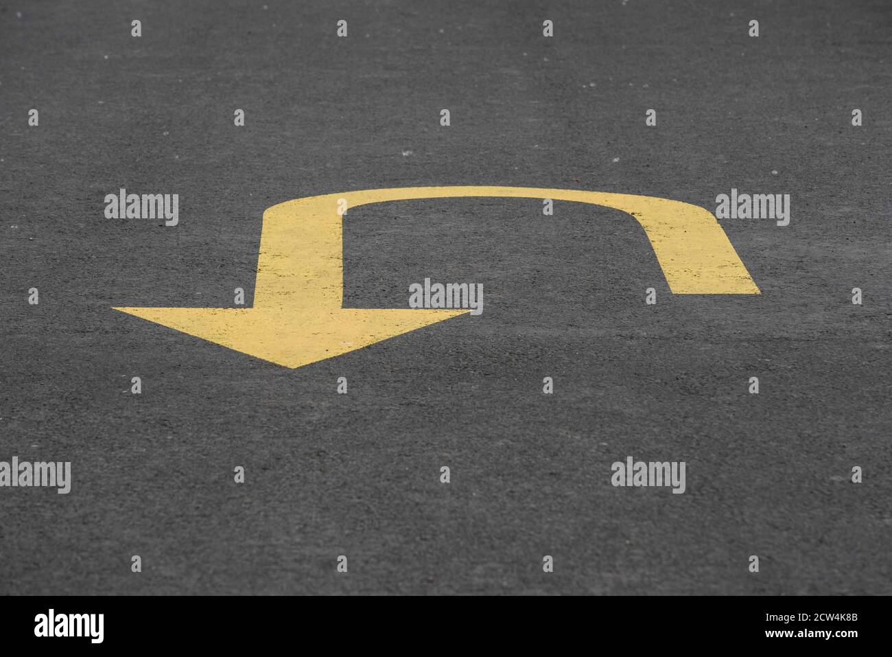 a turn around road traffic sign, marking on the street Stock Photo - Alamy