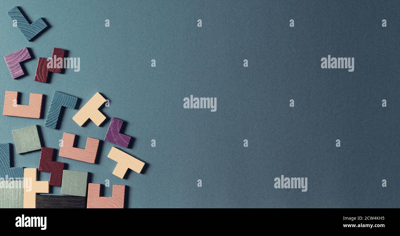 Different colorful shapes wooden puzzle blocks background. Geometric ...