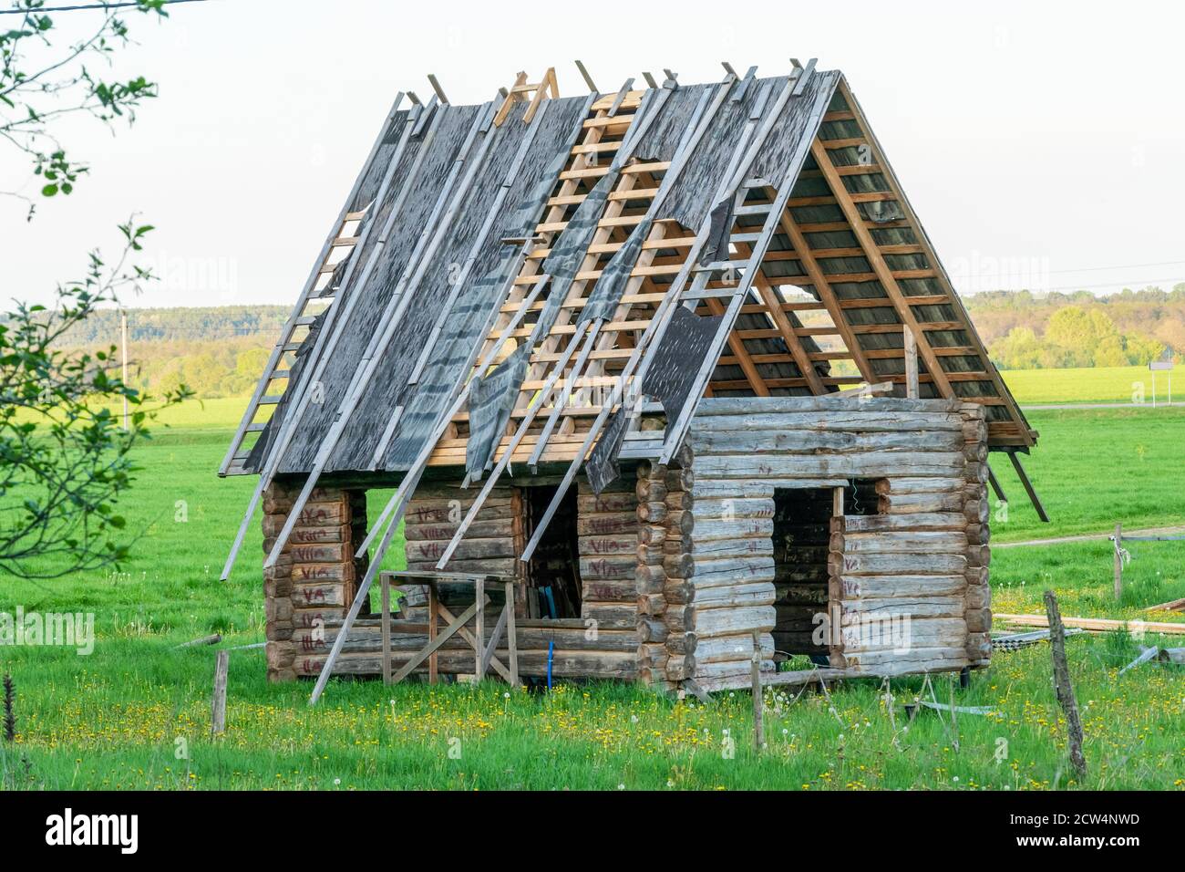 Unfinished wooden house. Construction of country houses. Suburban area ...