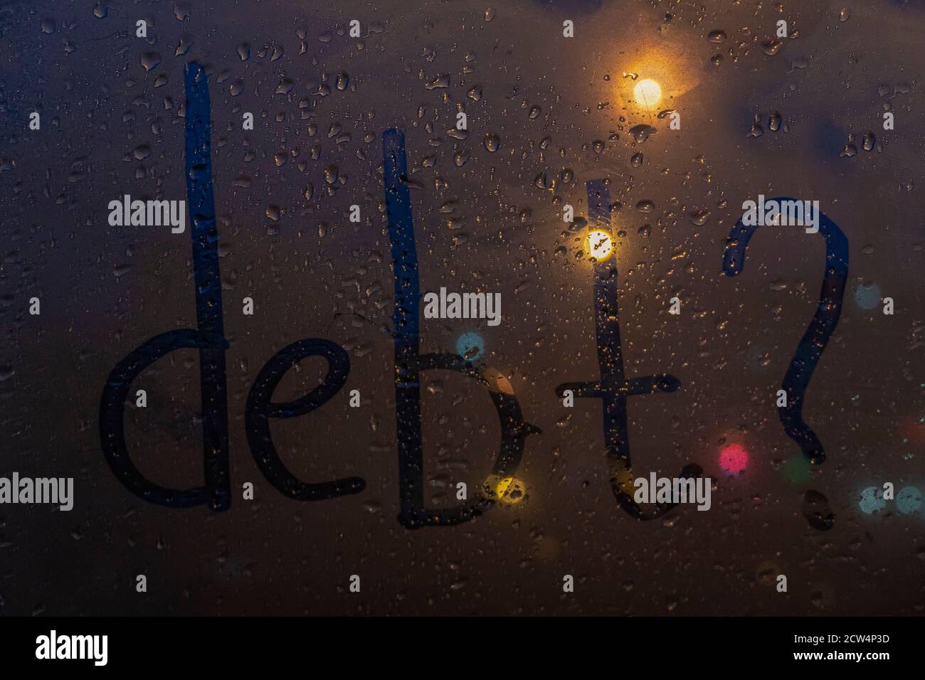 debt word written on the sweaty glass with a sign . copy space ...