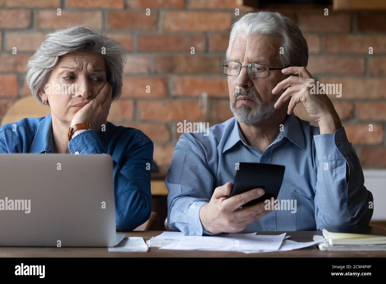 Stressed senior man and woman have problems paying online Stock Photo ...