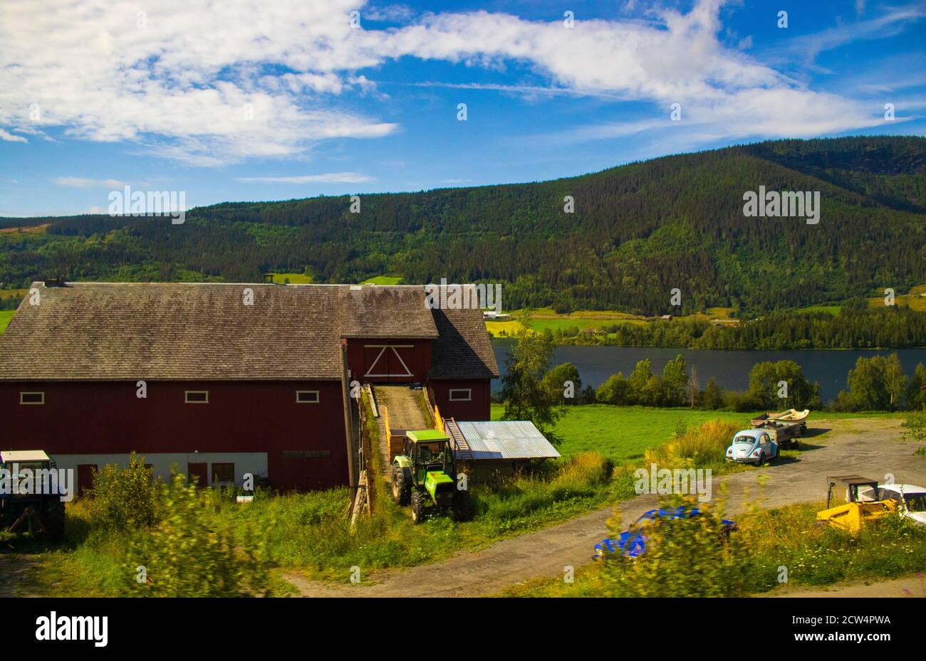 Farmhouses at Slidrefjord lake shore seen from E16-European route from ...