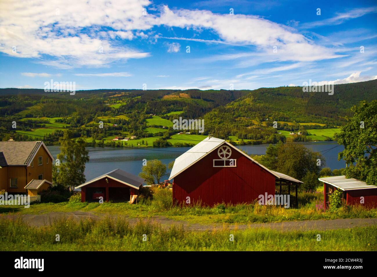 Farmhouses at Slidrefjord lake shore seen from E16-European route from ...