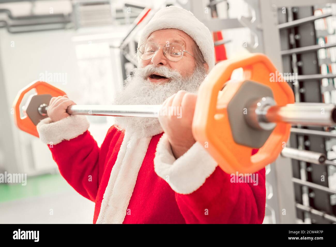 Santa Claus in the gym holiday concept Stock Photo - Alamy