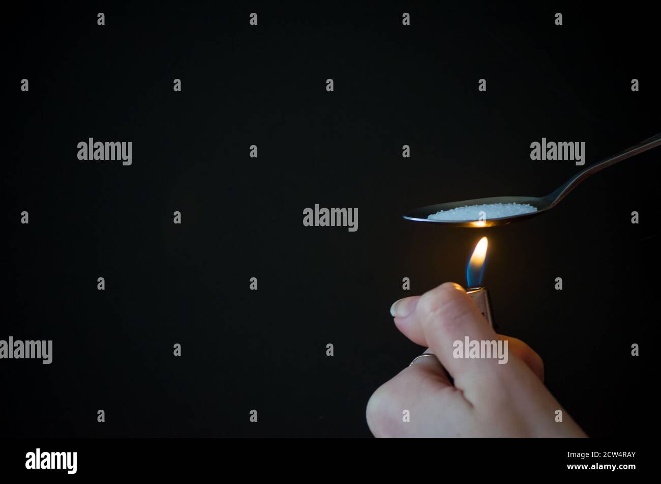 woman use fire and spoon for boiling water and narcotic, cocaine ...