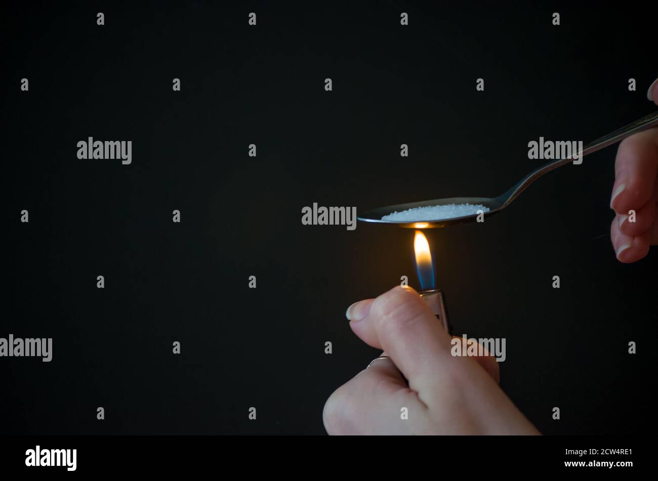 woman use fire and spoon for boiling water and narcotic, cocaine ...