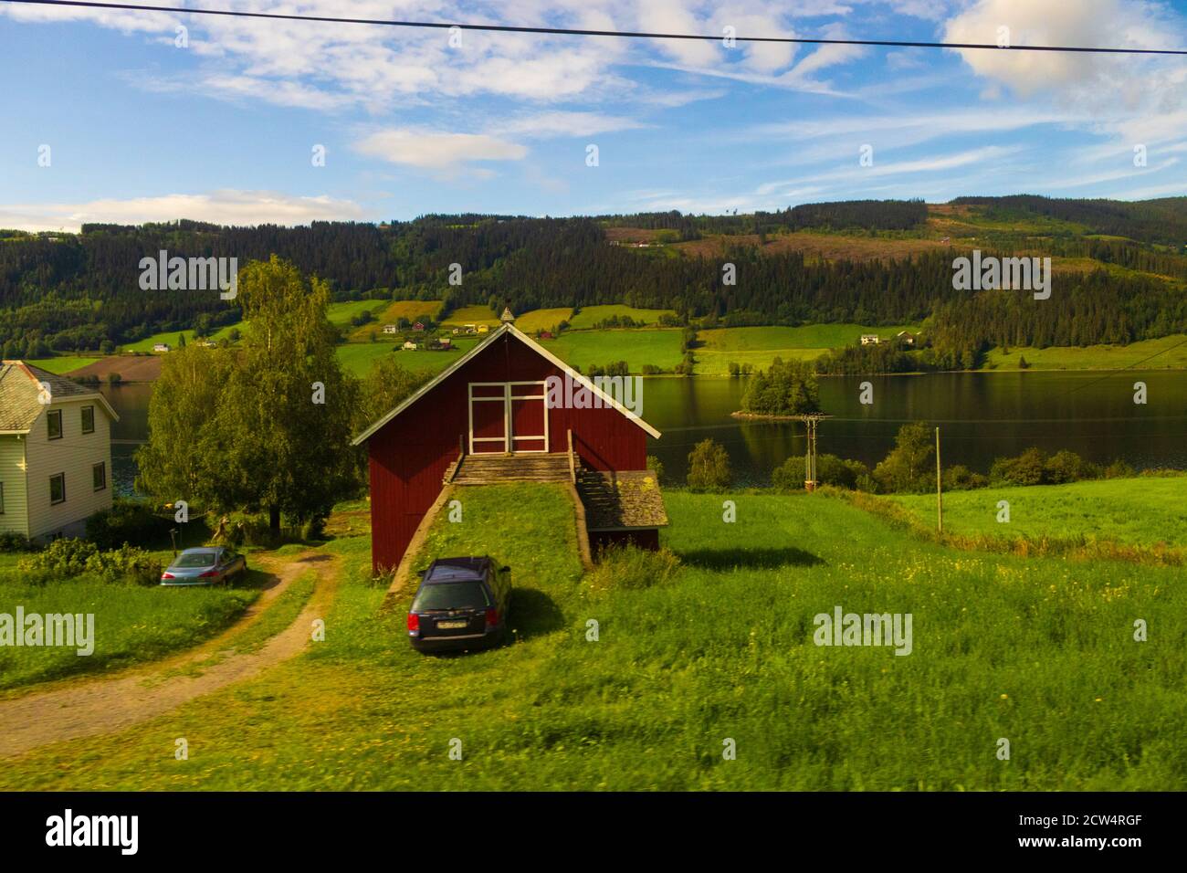 Red barn at Slidrefjord lake shore,Kvåle village Innlandet county in ...