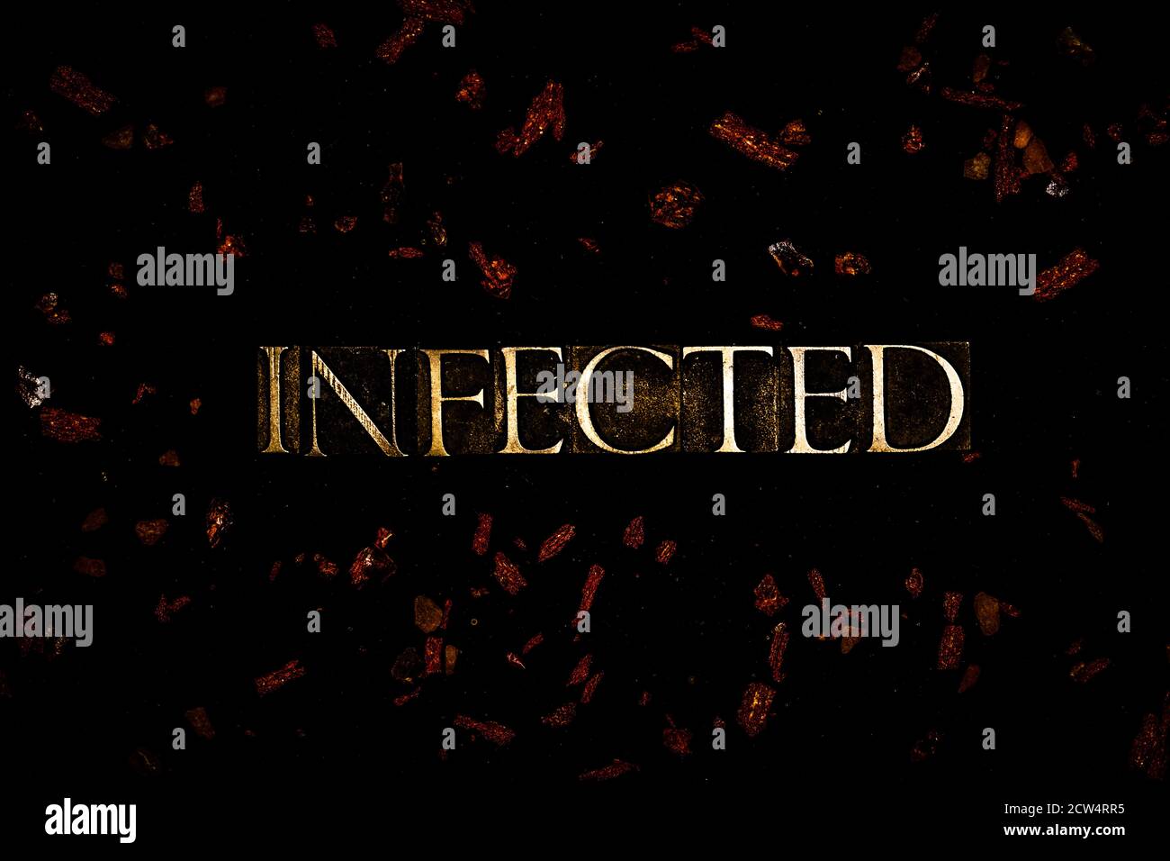 Infected text in flaming copper letters on black background with bright ...