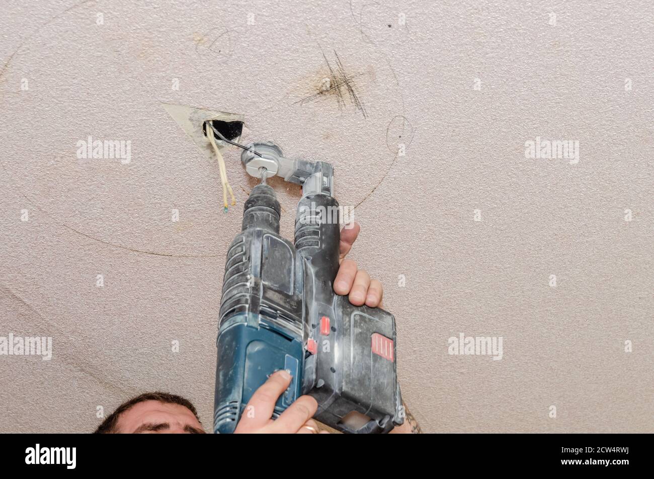 Handyman drilling ceiling hi-res stock photography and images - Alamy