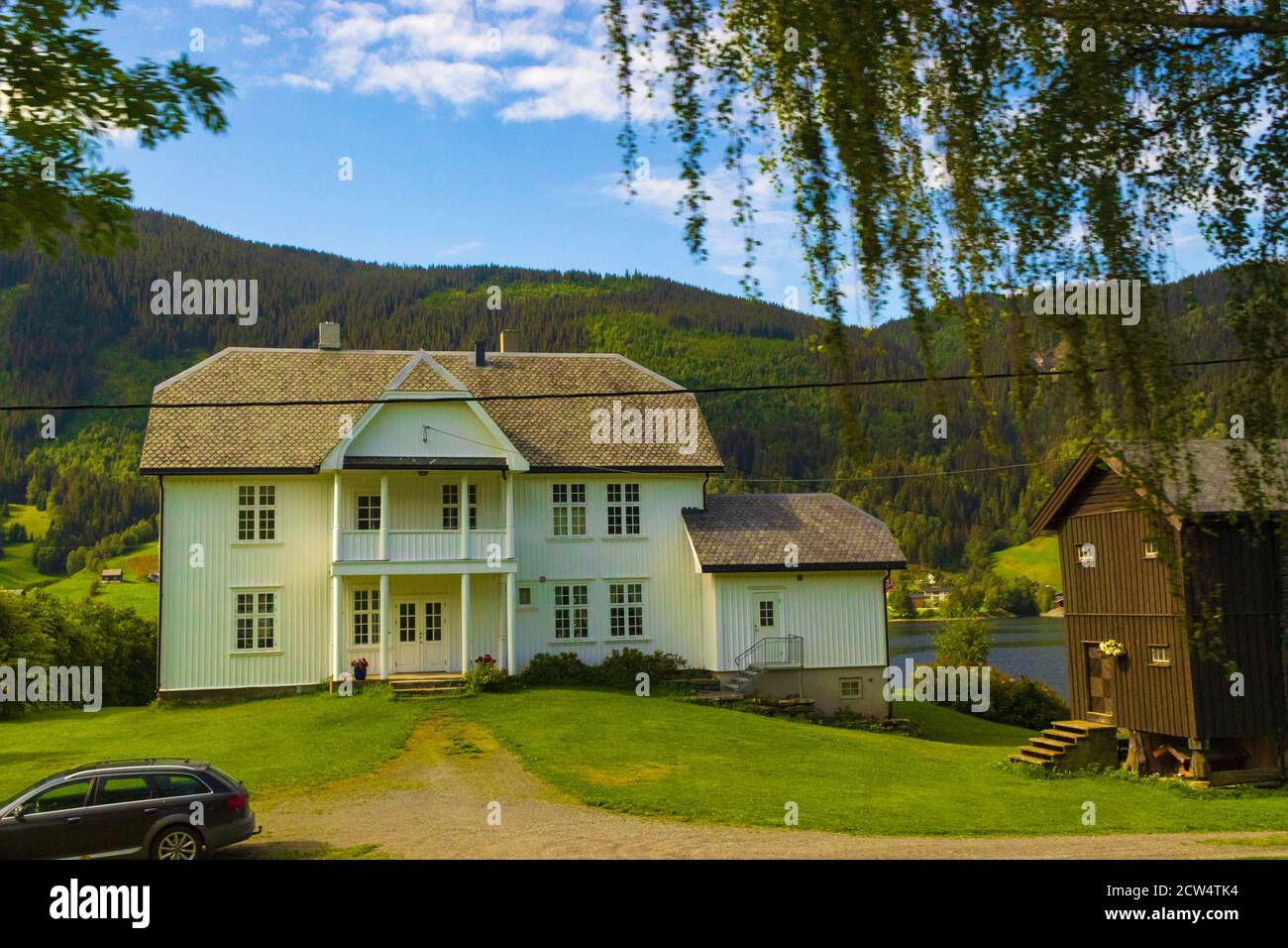 Traditional Scandinavian house at summer scenery seen from E16-European ...