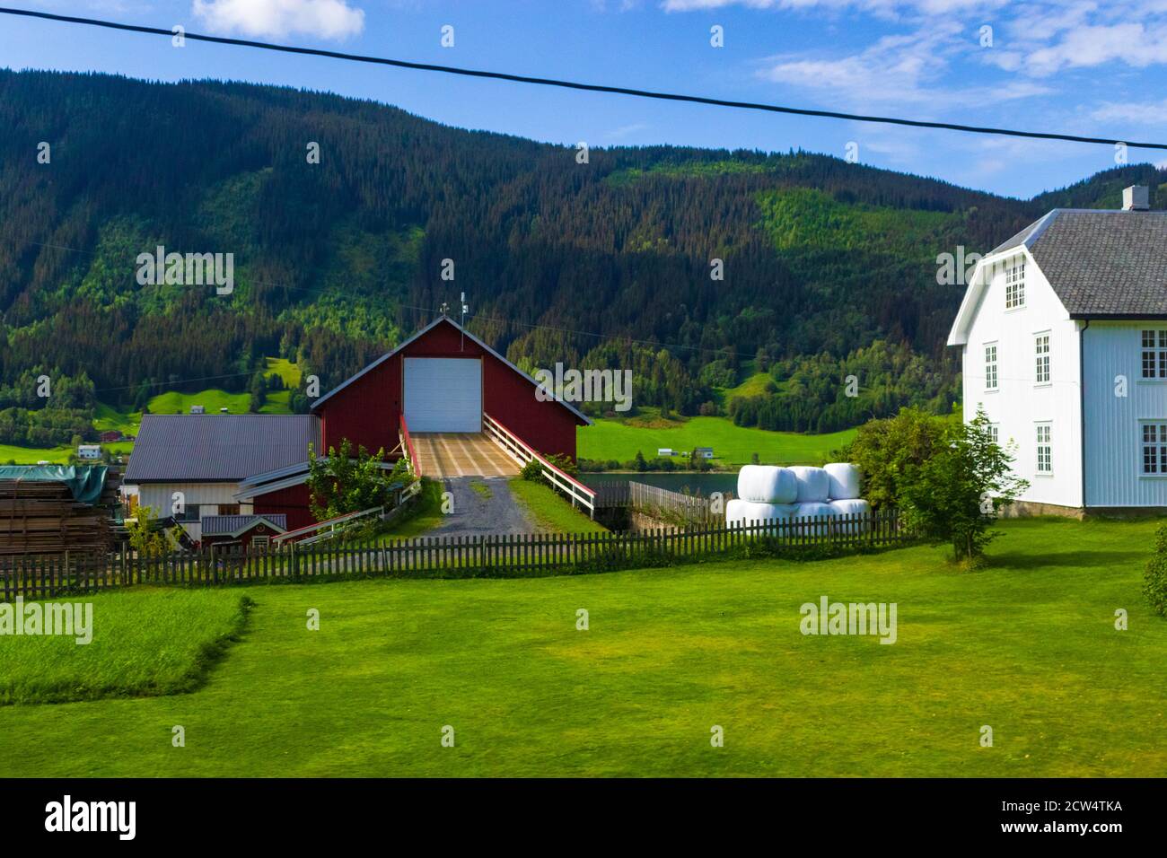 Farmhouses at Slidrefjord lake shore seen from E16-European route from ...