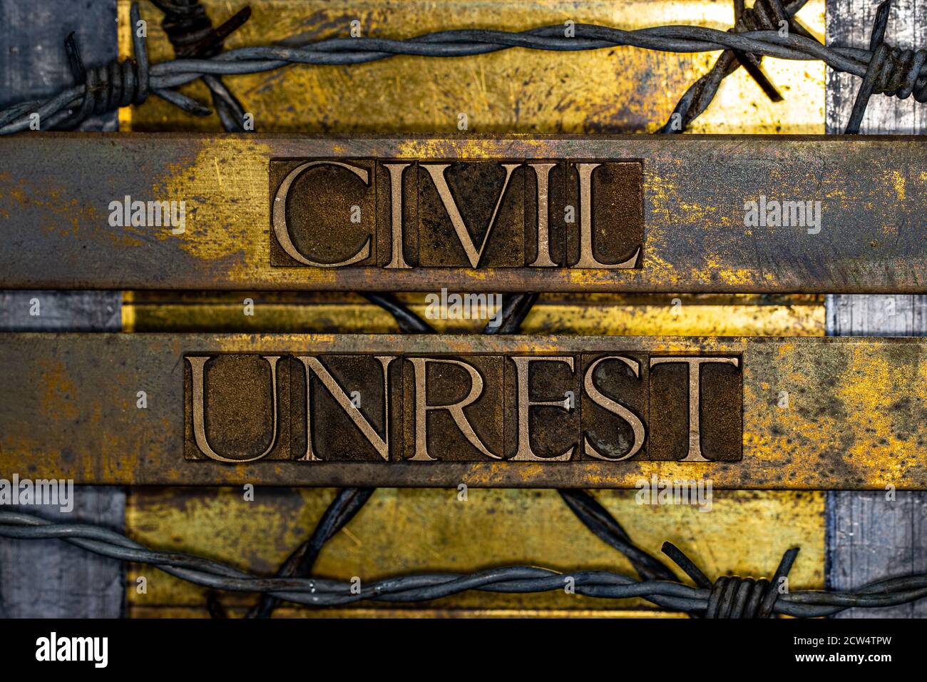 Civil Unrest text message on textured grunge copper and vintage gold ...