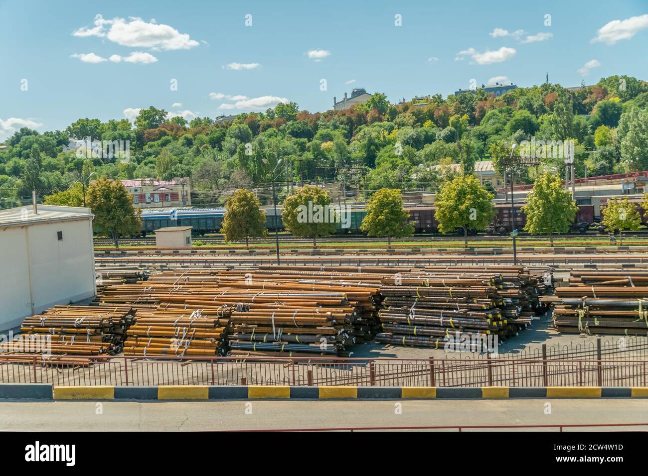 Metal rolling. Round pipes of large diameter are placed in a warehouse ...
