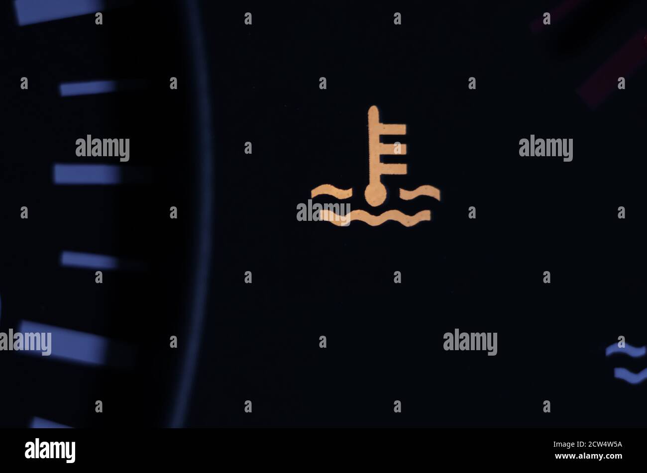 Lit yellow sign Overheating of the motor on the dashboard of the car ...