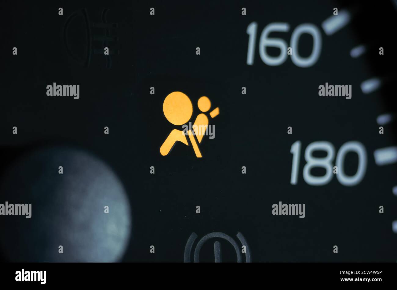 Yellow illuminated sign passenger Airbag close up Stock Photo - Alamy