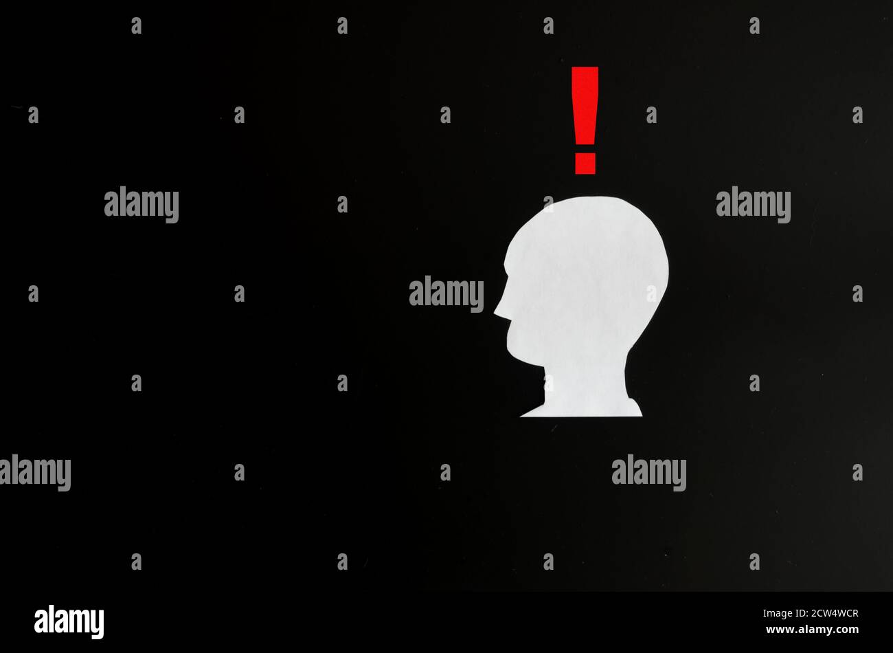 An image of a man's head with an exclamation mark above his head on a ...