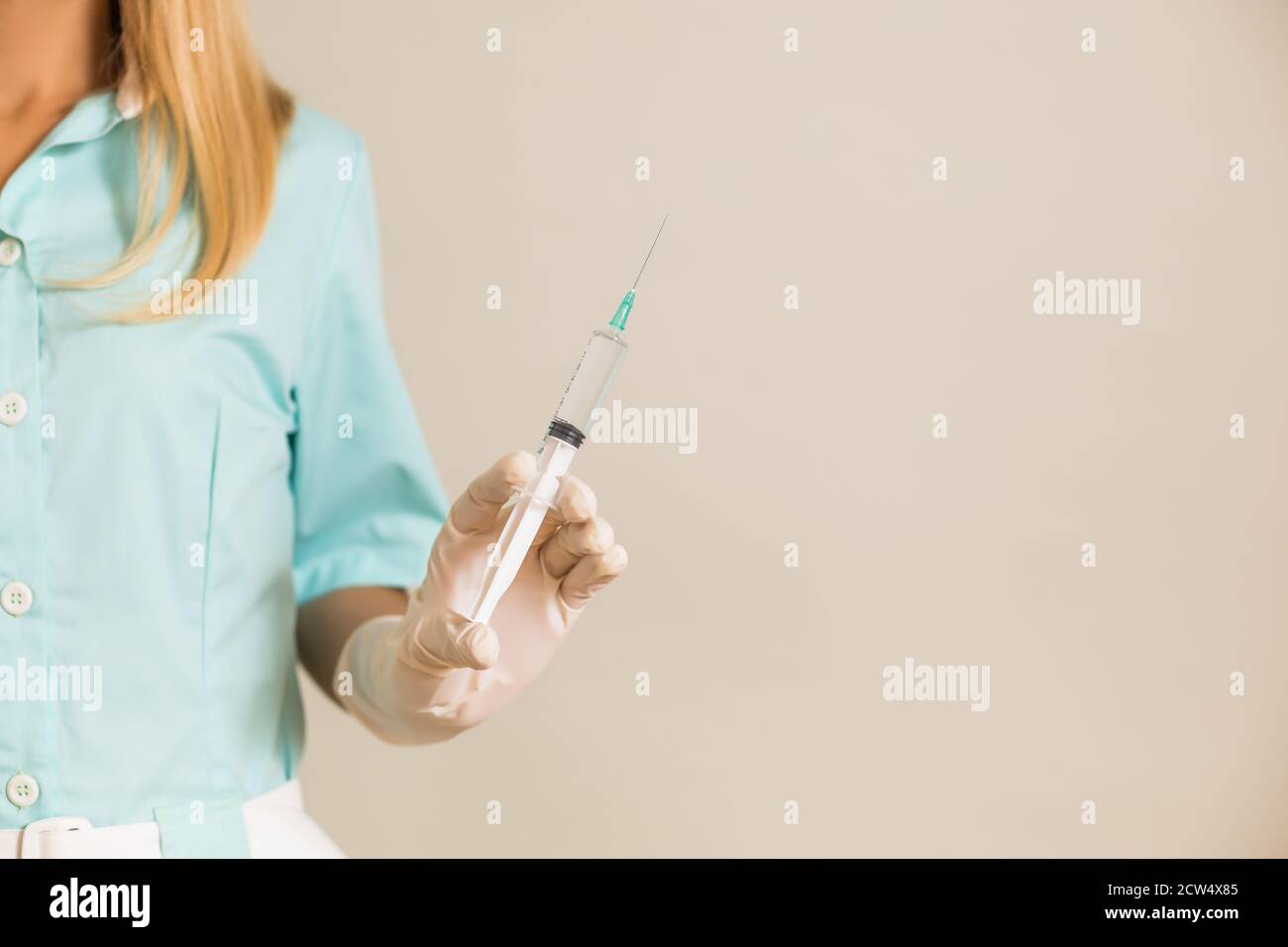 Image of medical nurse holding injection Stock Photo - Alamy
