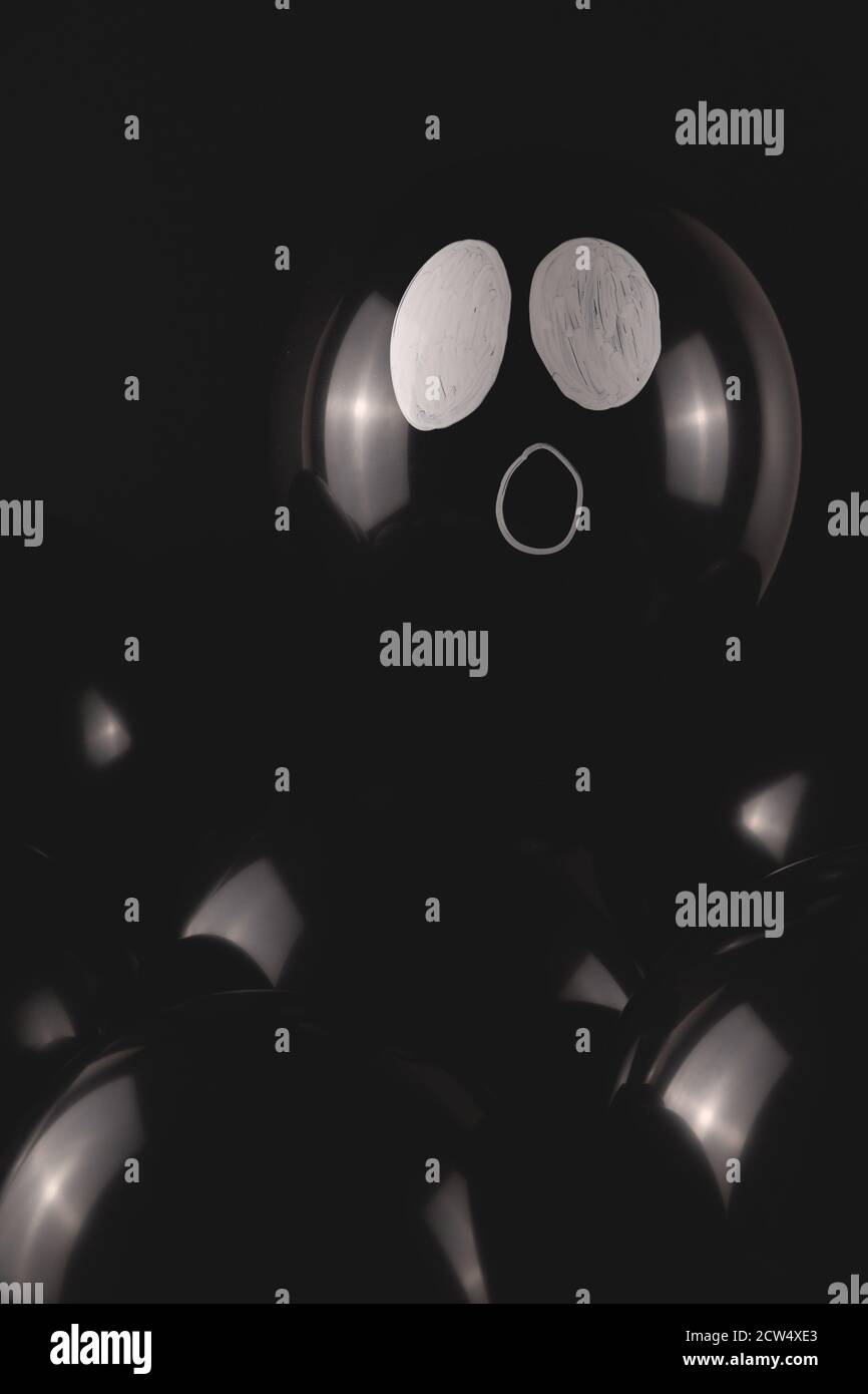 Black ball Halloween ghost decor. Minimalism and traditional ...