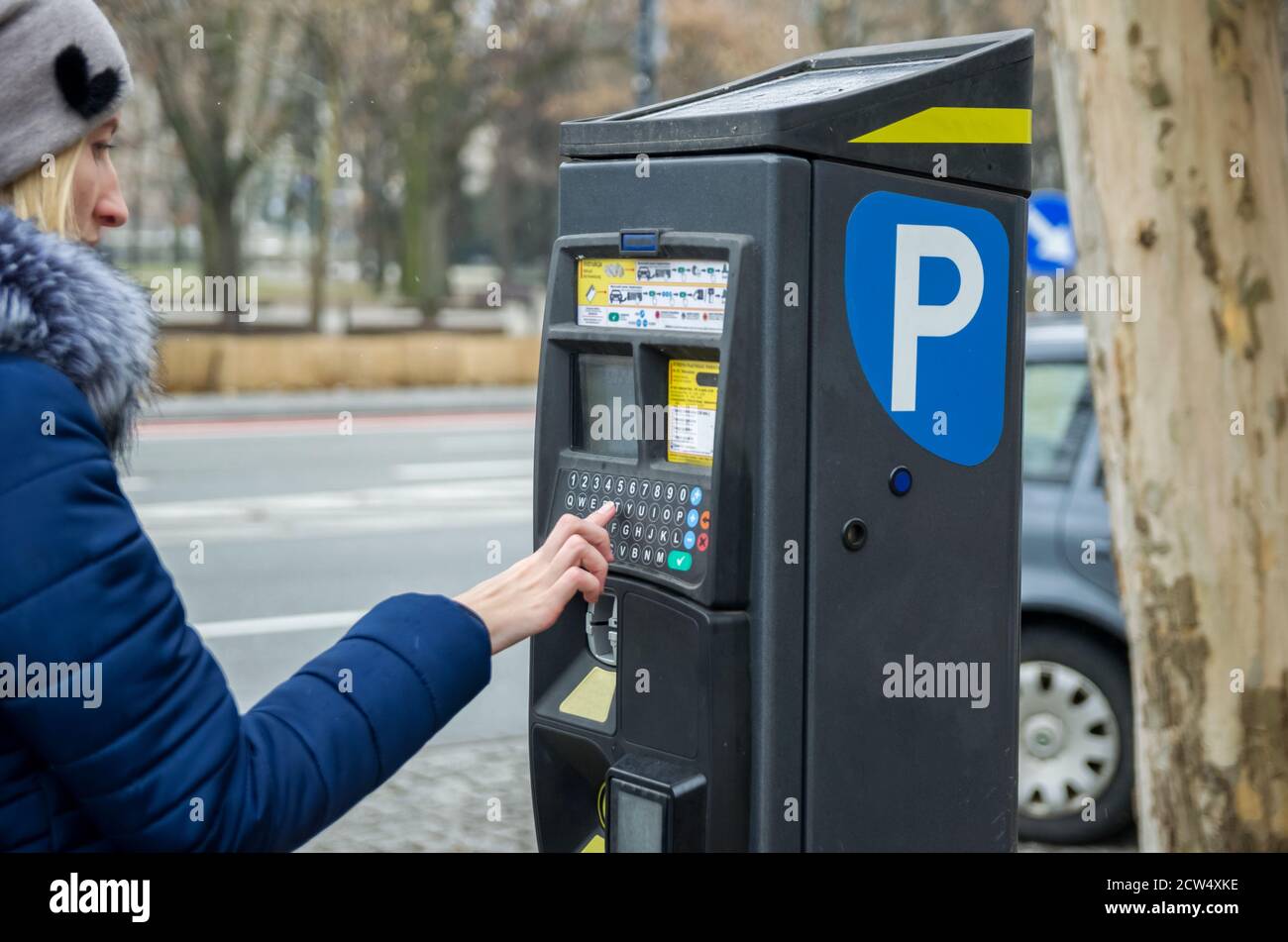 Woman using parking meter hi-res stock photography and images - Alamy