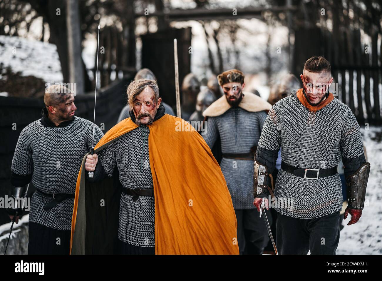 Photo of knights in armor with swords during the war. Evil emotions of ...