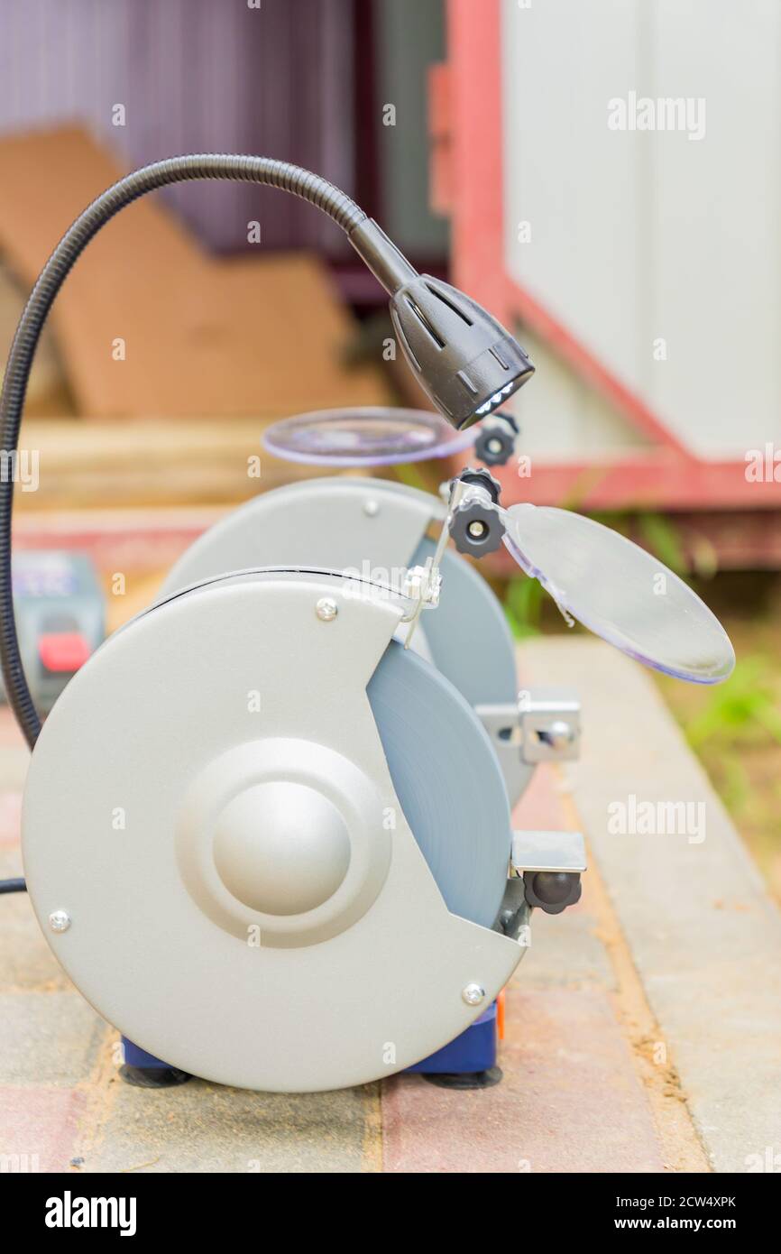 Mower blade sharpening grindstone hi-res stock photography and images ...