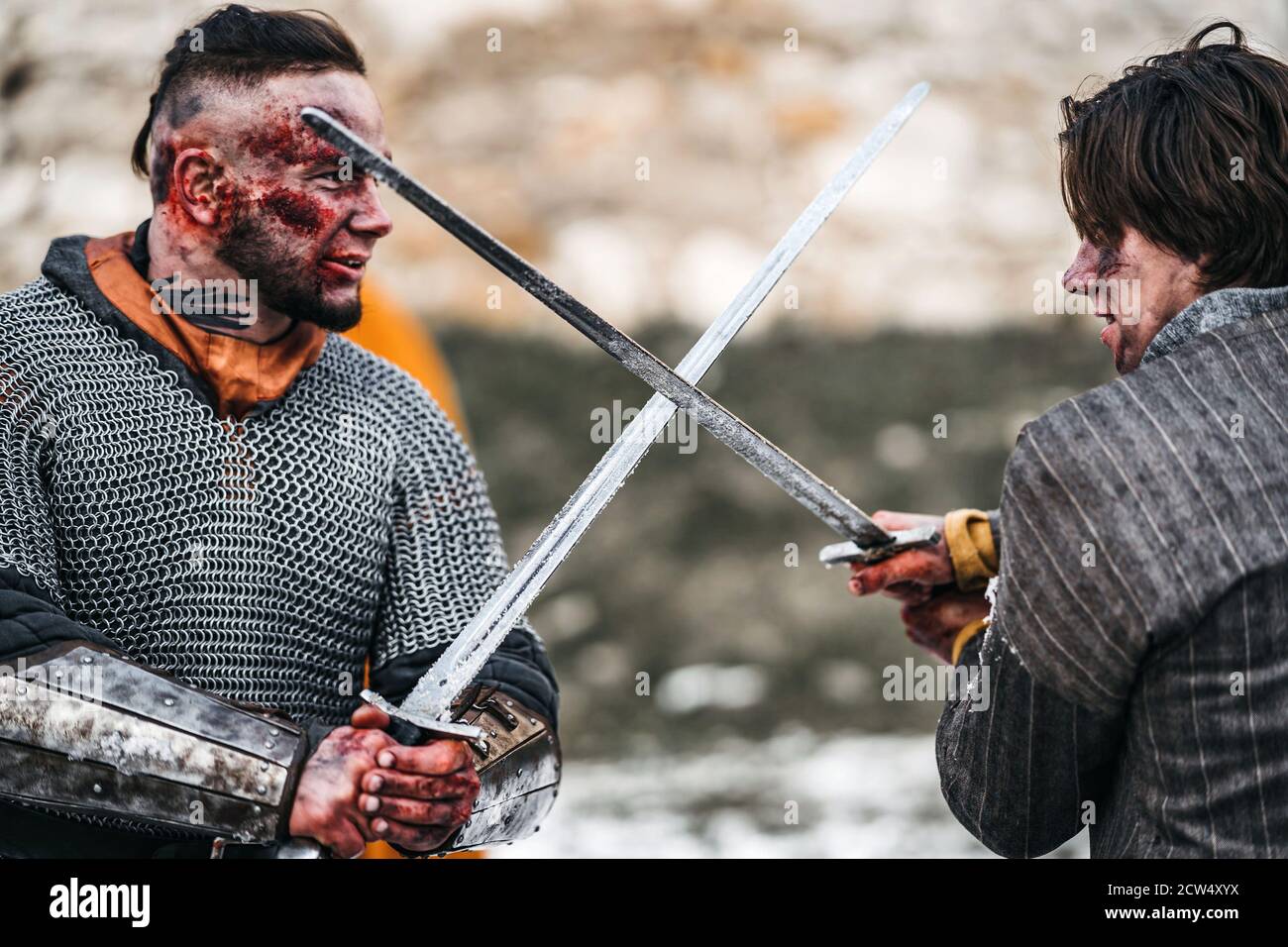 People Fighting In War With Swords