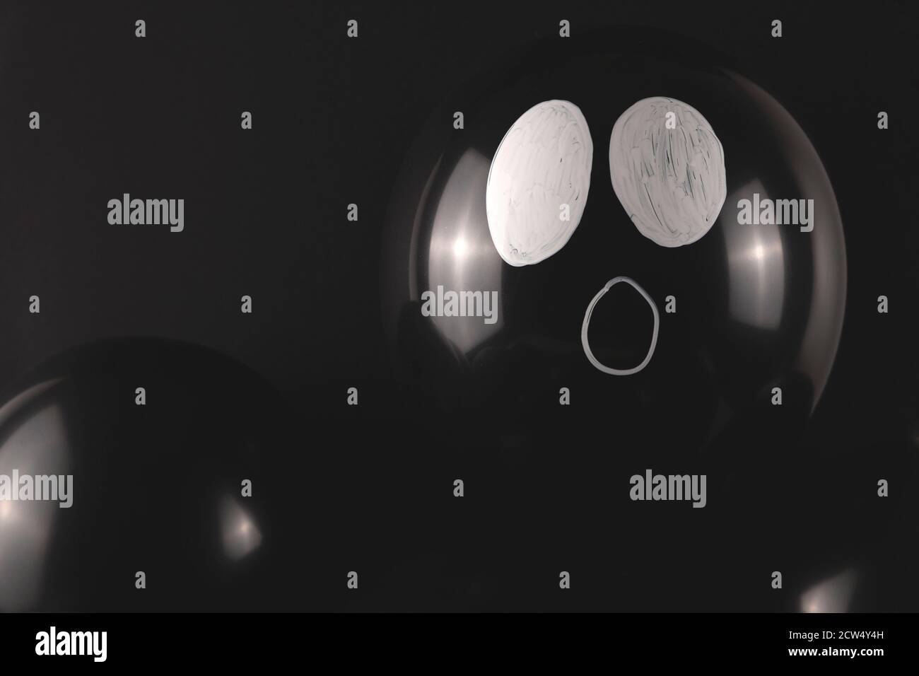 Black ball Halloween ghost decor. Minimalism and traditional ...