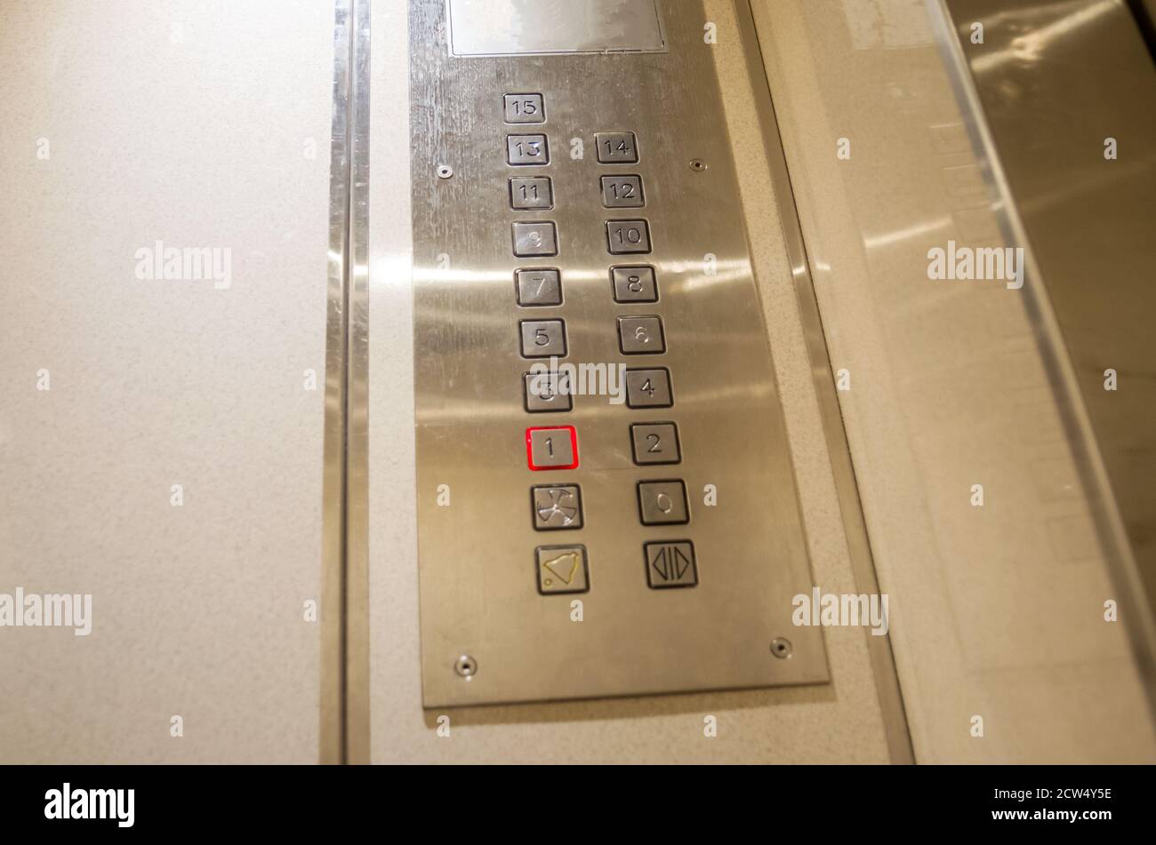 stainless steel dial of a passenger lift with glowing buttons Stock ...