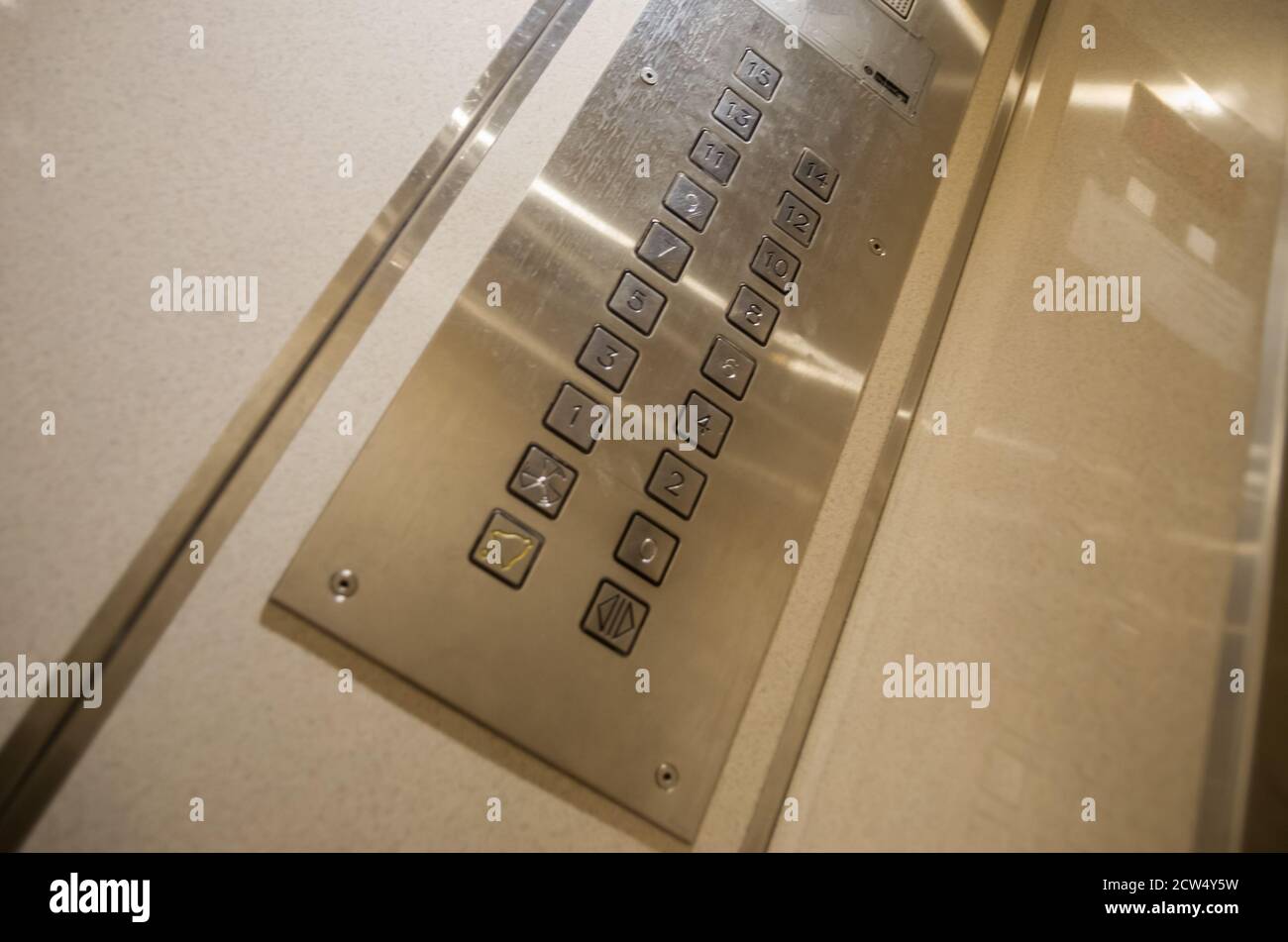stainless steel dial of a passenger lift with glowing buttons Stock ...