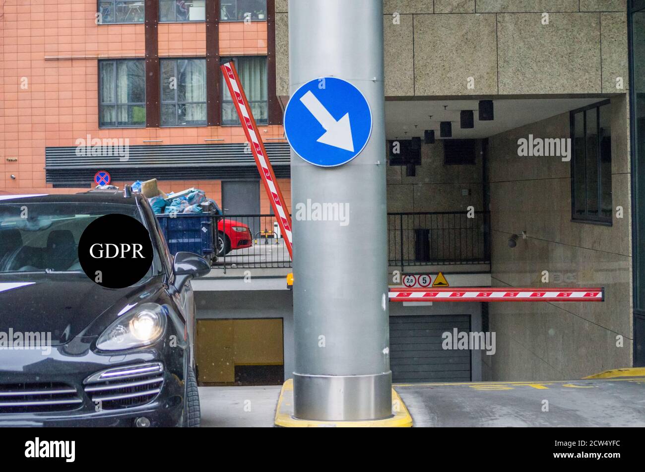 GDPR - a man leaving the underground parking lot, hides behind the words "Data Protection ...