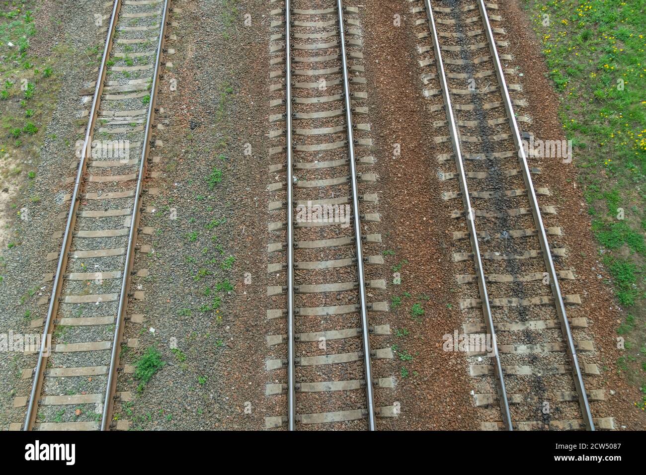 Railway tracks, top view. Brilliant iron rails and concrete sleepers in ...