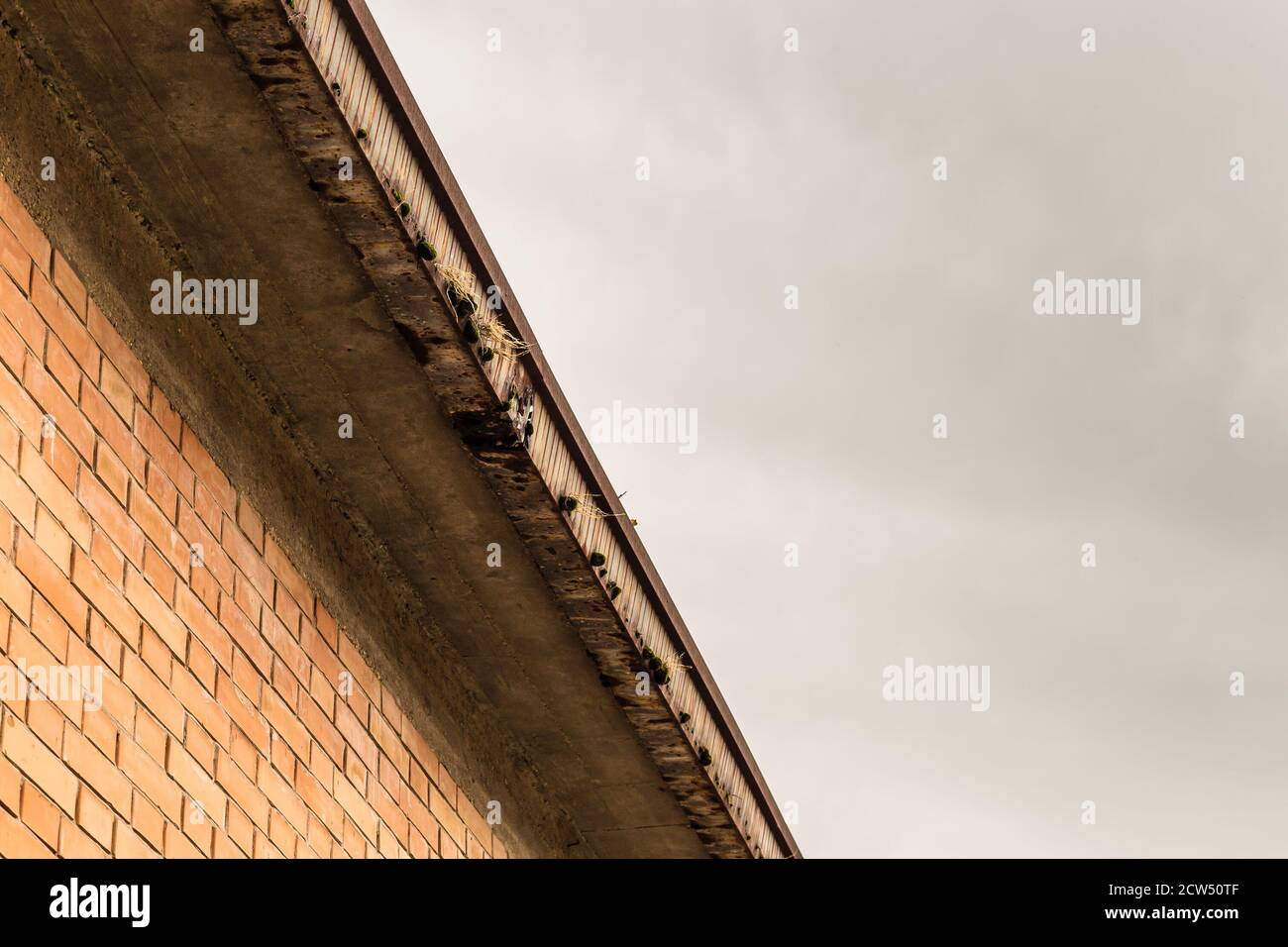 perforated gutters in old industrial warehouse Stock Photo - Alamy