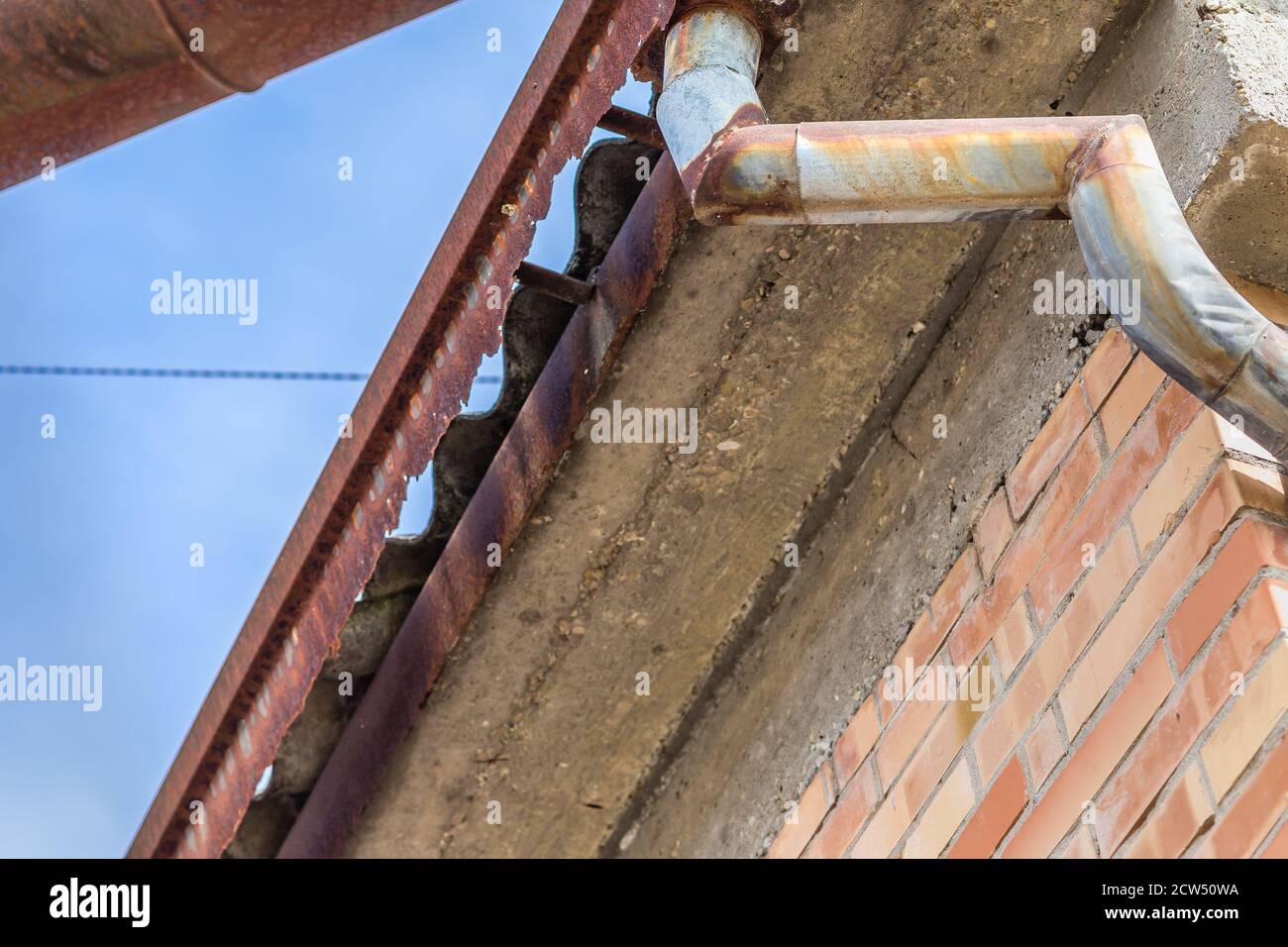 perforated gutters in old industrial warehouse Stock Photo - Alamy