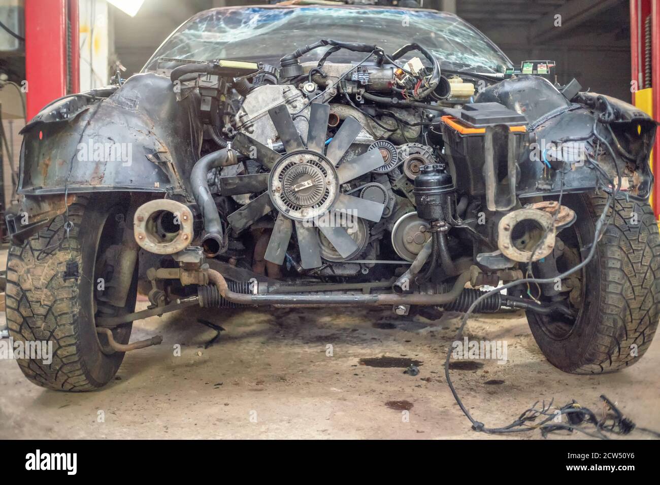 Semi-disassembled car after an accident close-up on the auto Assembly ...