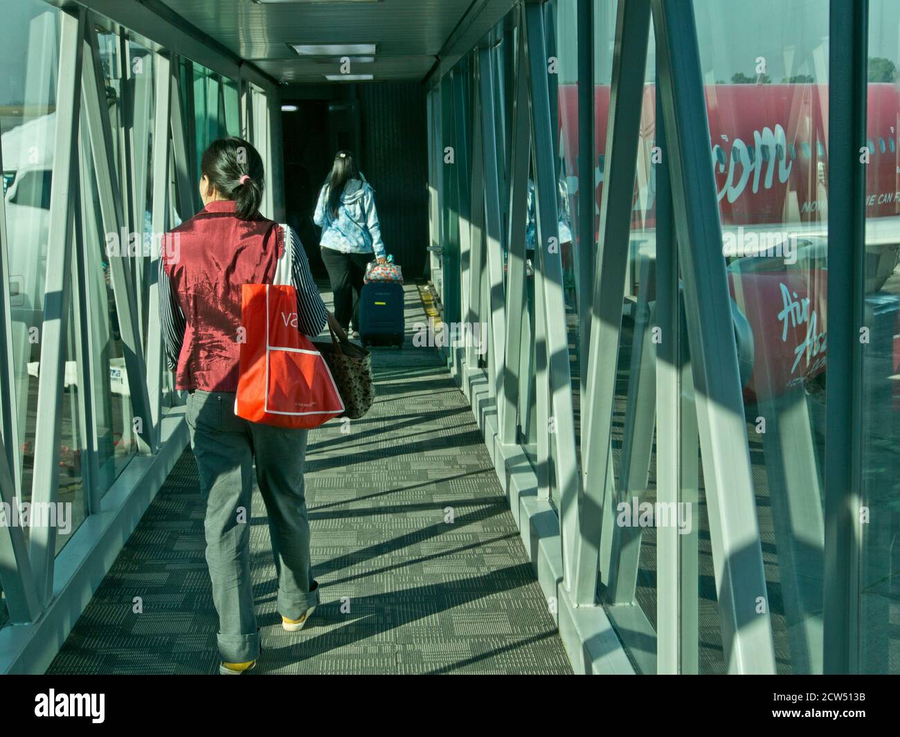 Passengers, airplanes and services at the terminal of Yangon ...