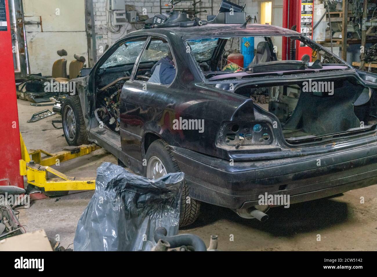 Semi-disassembled car after an accident close-up on the auto Assembly ...